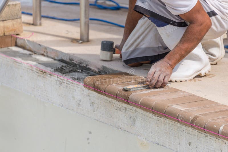 Setting New Brick Coping Pool Remodel Stock Image - Image of digging ...