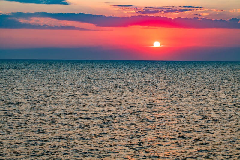 Setting Red Sun and Clouds Over the Sea at Sunset Stock Image - Image ...