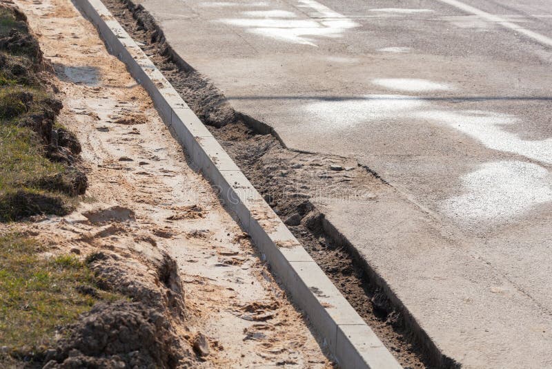 Setting Road Border before Laying Asphalt. Reconstruction of the ...