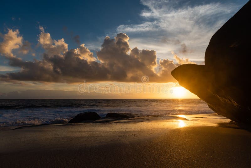 Setting Sun Above Huge Rock at Beach Stock Photo - Image of resort ...