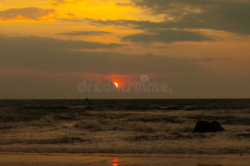 Setting sun at the beach stock image. Image of blue - 178890463