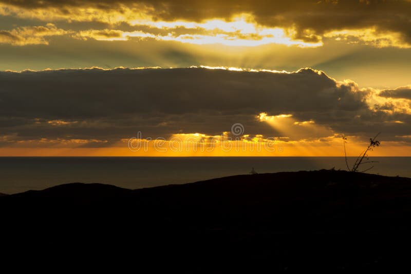Setting Sun Behind Cloud, Rays, Sea Orange Stock Photo - Image of cloud ...