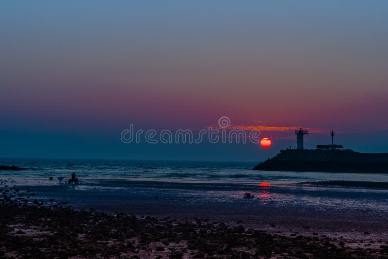 Setting Sun Behind Lighthouse Stock Image - Image of formation ...