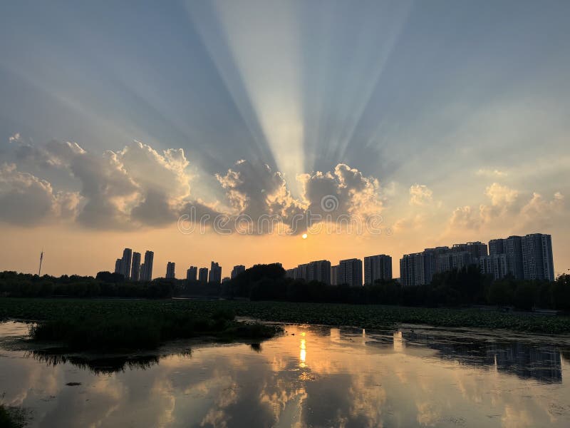 The Setting Sun Casts Its Golden Rays, the Evening Sky is Adorned with ...