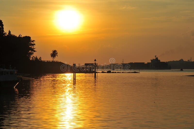 Setting Sun at Changi Jetty Stock Image - Image of evening, orange ...