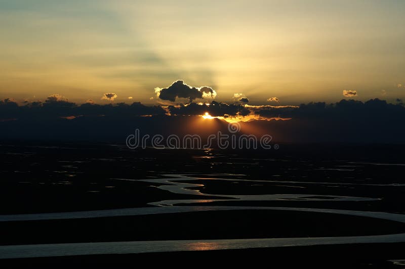 The Setting Sun on the Grassland Stock Photo - Image of grassland ...
