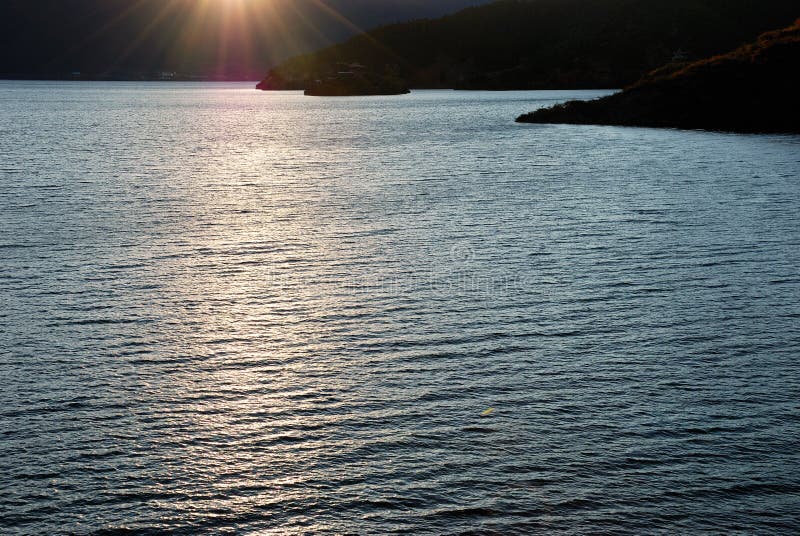 In setting sun lake stock image. Image of landform, light - 7203473