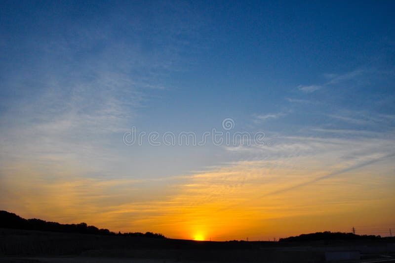 Setting sun over the hills stock image. Image of color - 159148171