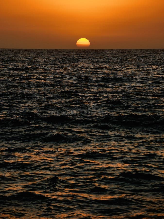 Setting sun over the ocean stock image. Image of nature - 54483757