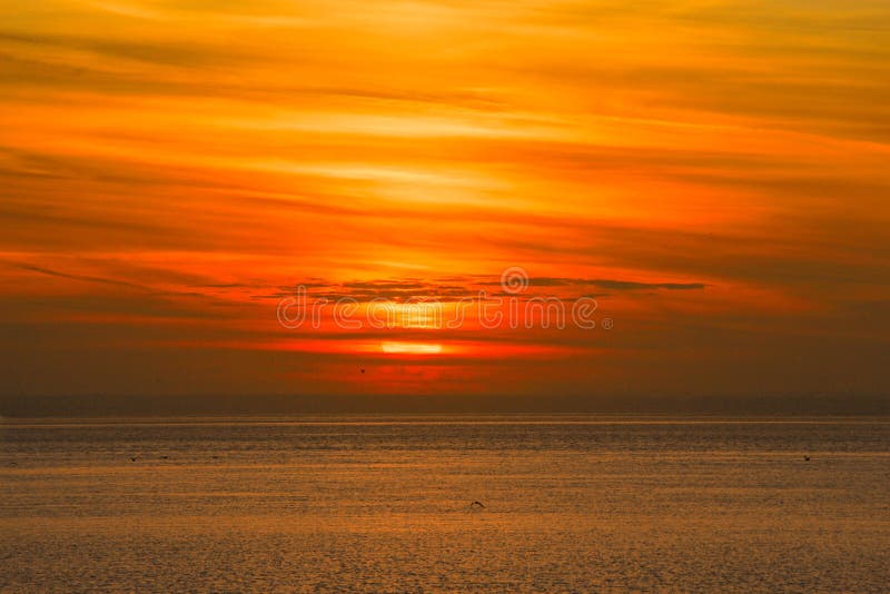 The Setting Sun Over the Water Surface Stock Photo - Image of dream ...