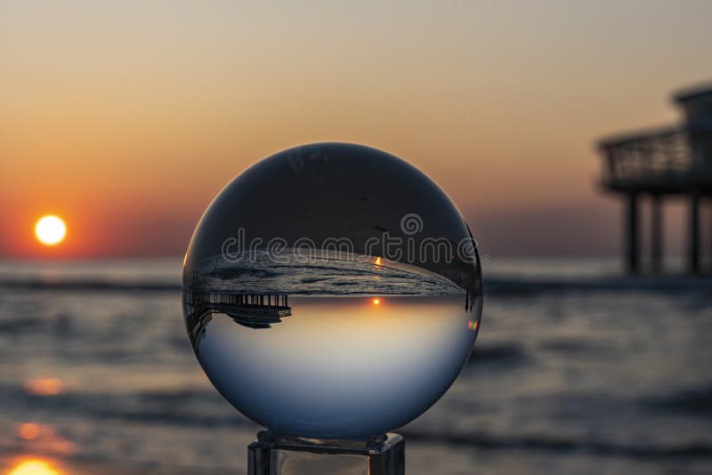 The Setting Sun at the Pier in Scheveningen is Inverted in the Lens ...
