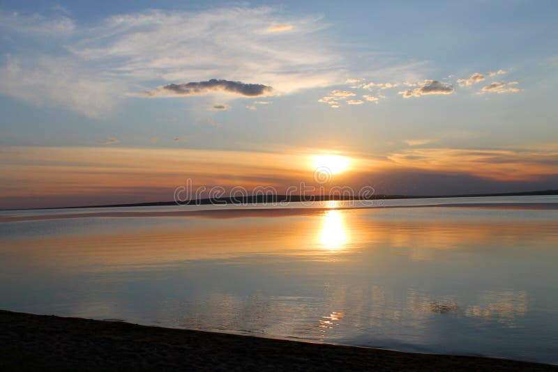 The Setting Sun Reflected in the Pond Stock Image - Image of horizon ...