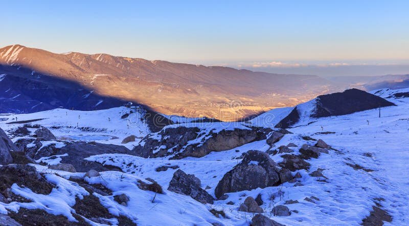 The Setting Sun in the Snow-capped Mountains Stock Image - Image of ...