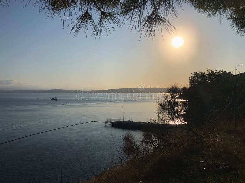 Setting sun view seaside stock image. Image of reflection - 204992831