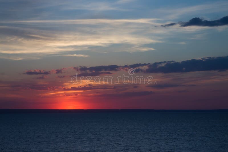 The Setting Sun in the Volga River Stock Photo - Image of glow, blue ...
