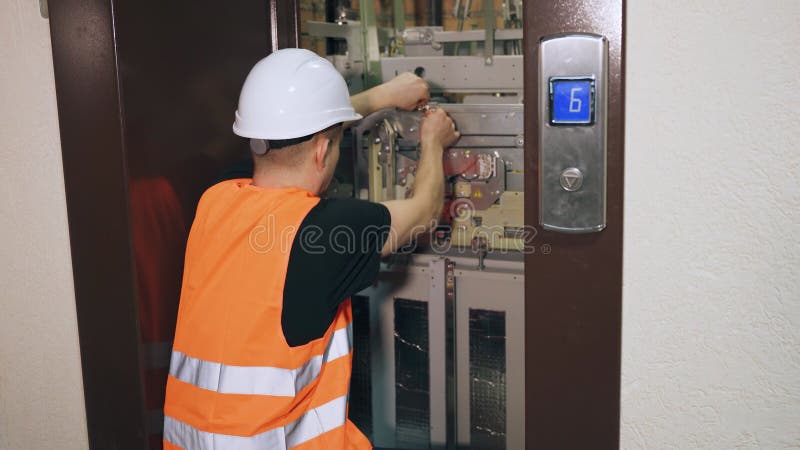 A Utility Service Engineer Replaces Worn Parts To Ensure the Safety of ...