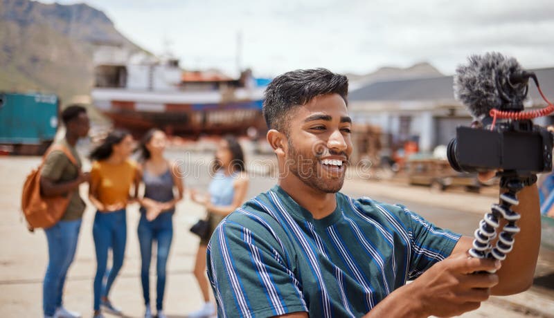 Setting Up His Camera before he Records. a Young Man Using a Digital ...