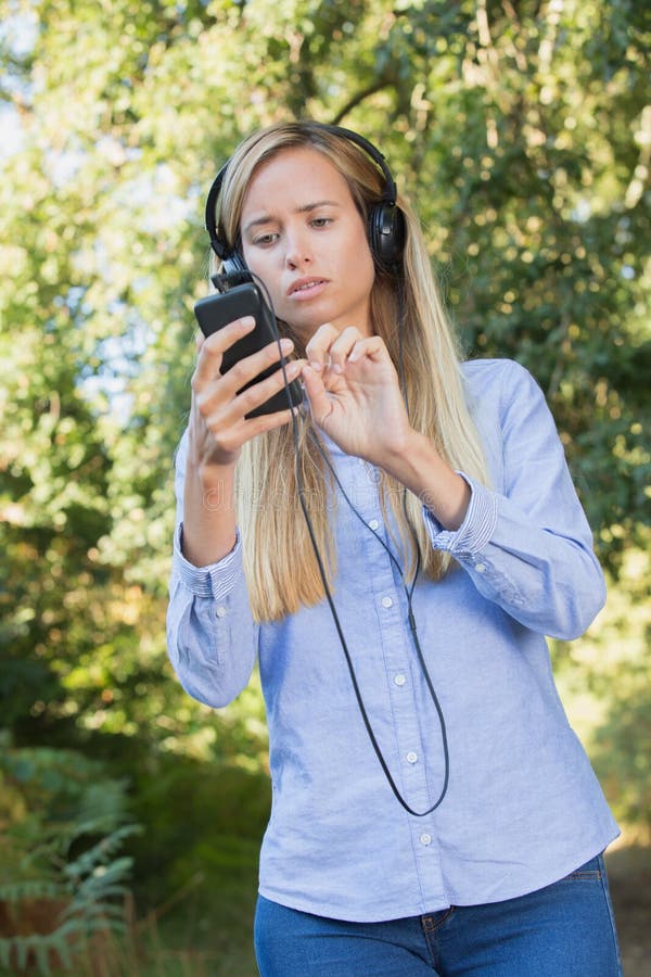 Setting Up Playlist for Walking Stock Image - Image of listening, sport ...