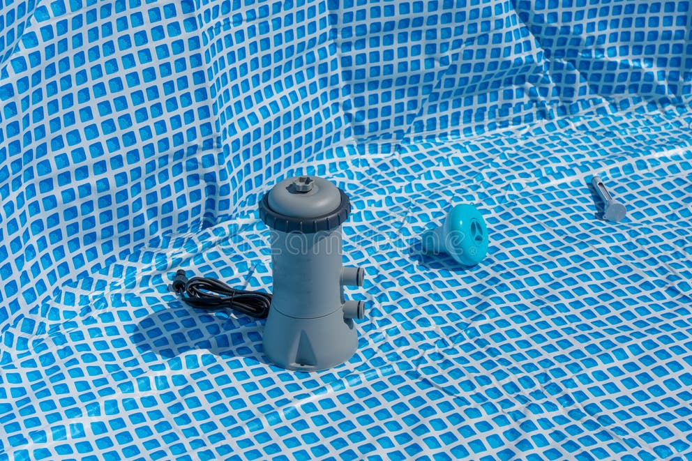 Setting Up a Pool with Pump and Accessories on a Blue and White ...
