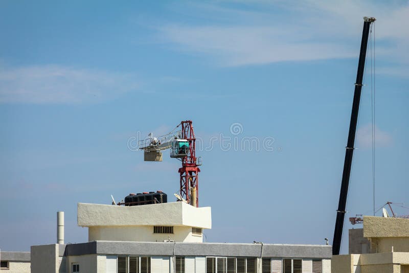 Setting Up a Tower Crane in the Construction Site. Stock Photo - Image ...