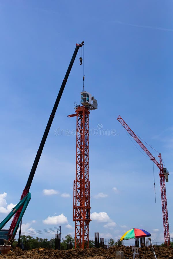 Setting Up a Tower Crane in the Construction Site Stock Photo - Image ... Setting Up a Tower Crane in the Construction Site Stock Photo - Image ...