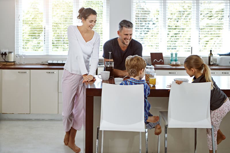 Settling Down for Breakfast. a Family Having Breakfast Together. Stock ...