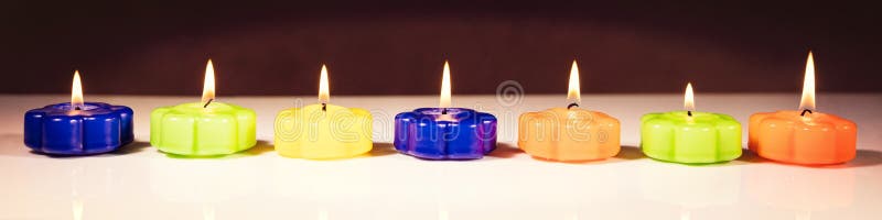Seven Burning Candles in a Row Stock Photo - Image of yellow ...