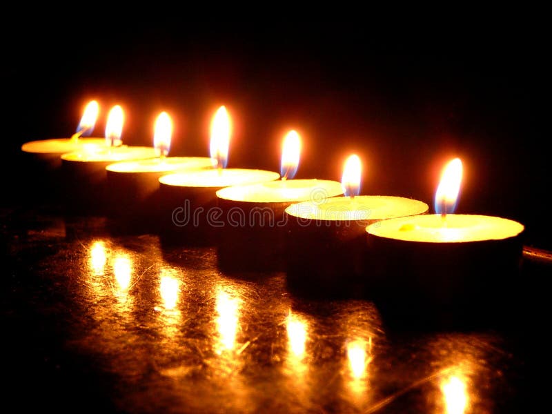 Seven candles stock image. Image of ardent, reflex, wick - 1476887