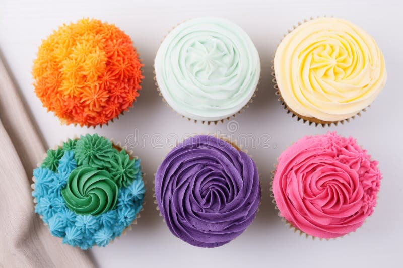 Seven Cupcakes Arranged in a Rainbow Colors Stock Photo - Image of ...