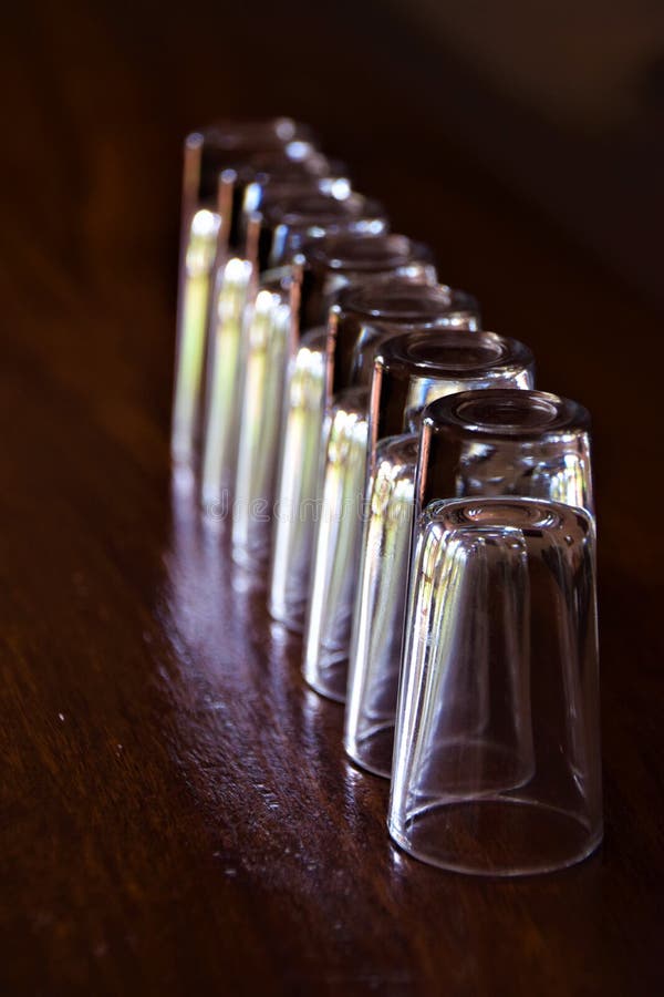 Empty Shot Glasses on Bar Counter Upside Down Stock Image - Image of ...