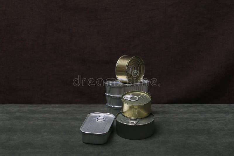 Seven Iron Cans of Canned Food on a Green Table Stock Photo - Image of ...