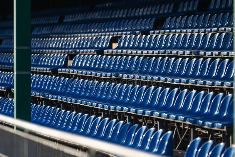 Seven Rows of Blue Seats by a Football Pitch.. Stock Image - Image of ...