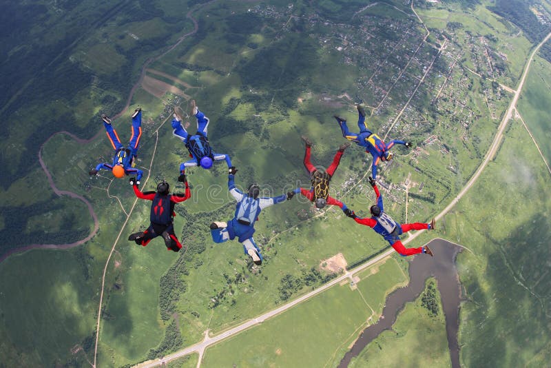 Seven Skydivers are in the Blue Sky. Stock Photo - Image of grip ...