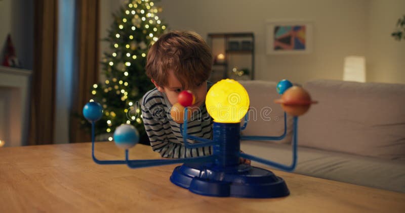 Cheerful Boy Sitting on the Couch with Uncle. they Will Look at Model ...