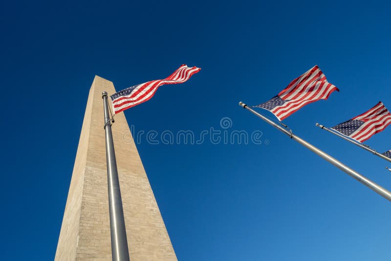 Several American Flags and the Washington Monument, Looking Up Stock ...