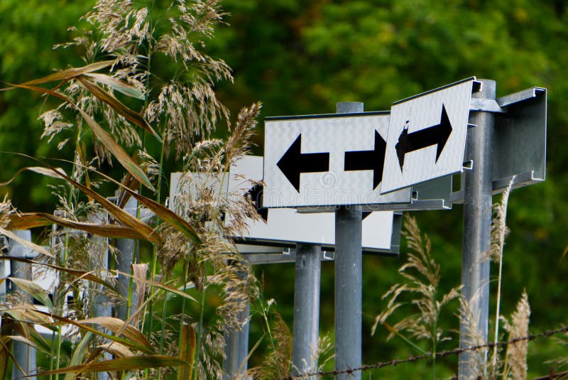 Several Arrow Signs with Reed Straws Stock Image - Image of signs, fall ...