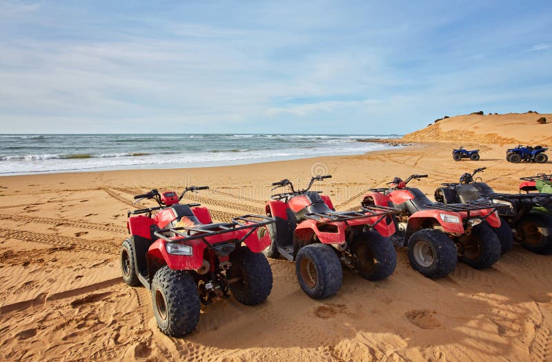 Several ATVs on the beach stock photo. Image of bike - 206413770