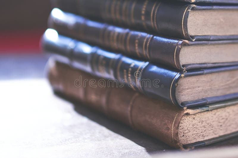 Several Books Stacked in a Tower on a Desk Stock Image - Image of ...