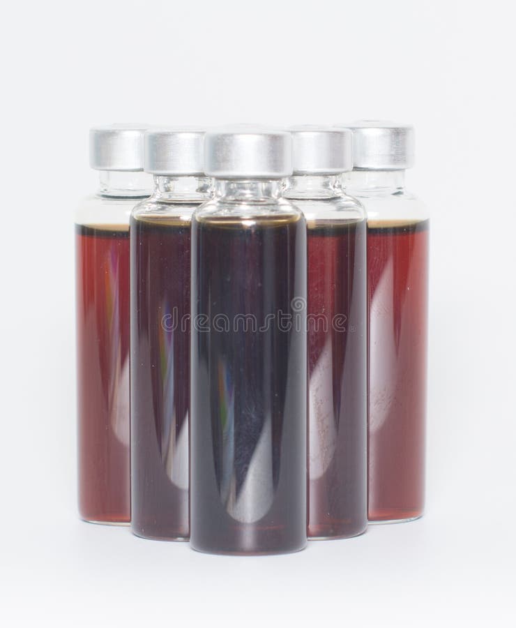 Several Bottles of Liquid Medicine Stock Photo - Image of brown, bottle ...