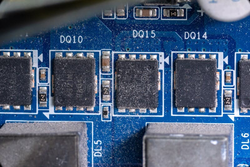 Several Chips on a Blue Motherboard in a Close-up of a Personal ...