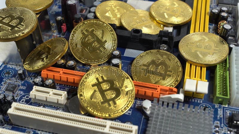 Several Coins of Bitcoins and a Strip of Electronic Memory on a Light ...