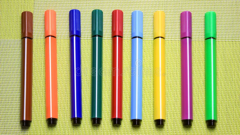 Several Colored Markers on a Light Green Surface Stock Image - Image of ...