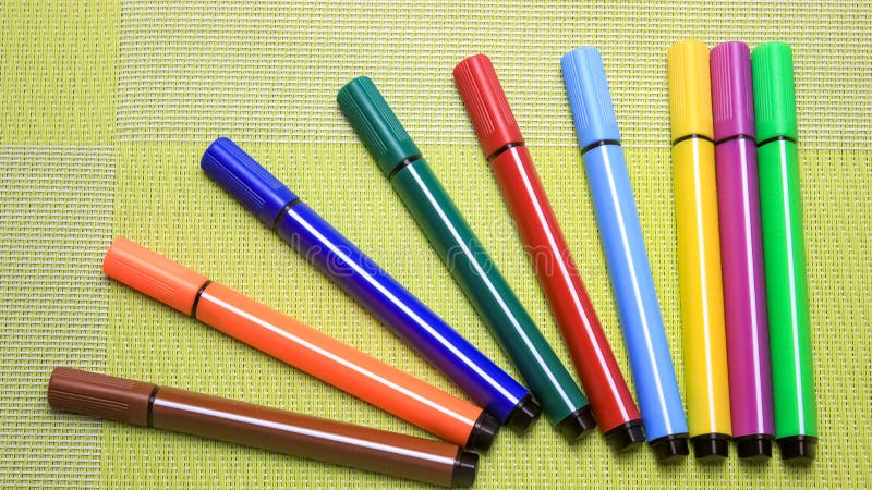 Several Colored Markers on a Light Green Surface Stock Image - Image of ...