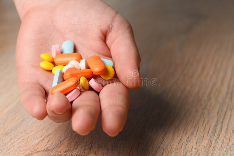 Several Colored Tablets in Hand Close-up. Concept of Assistance in Case ...
