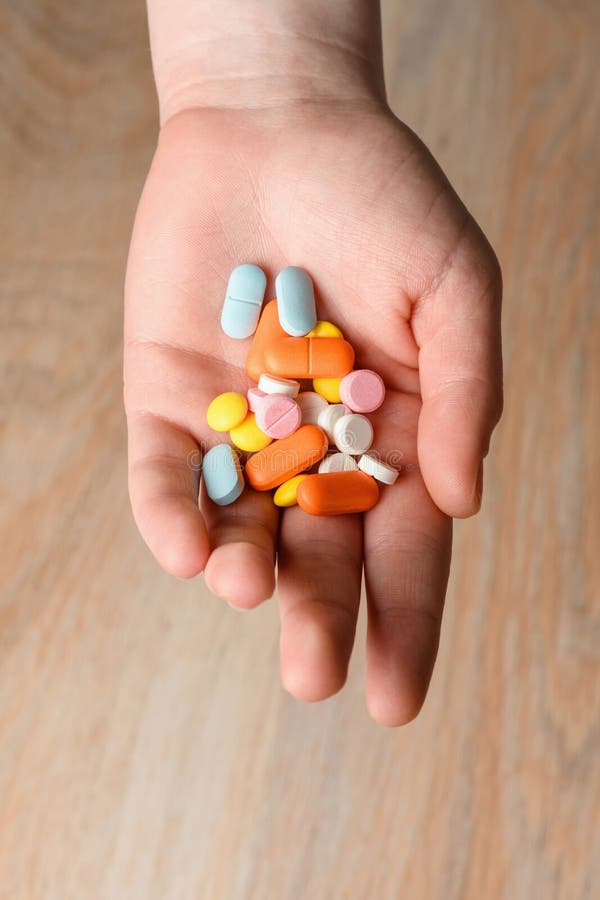Several Colored Tablets in Hand Close-up. Concept of Assistance in Case ...