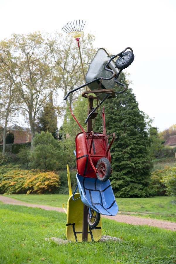 Coloured Wheelbarrows in a Garden Stock Image - Image of gardening ...