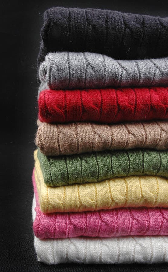 Pile of Knitted Winter Clothes on Wooden Background, Sweaters, Knitwear ...