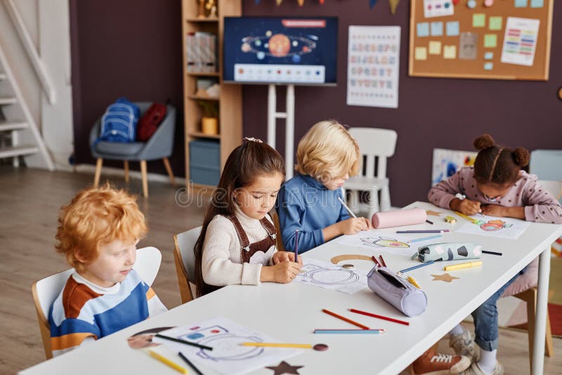 Several Cute Intercultural Learners of Primary School Sitting by Table ...
