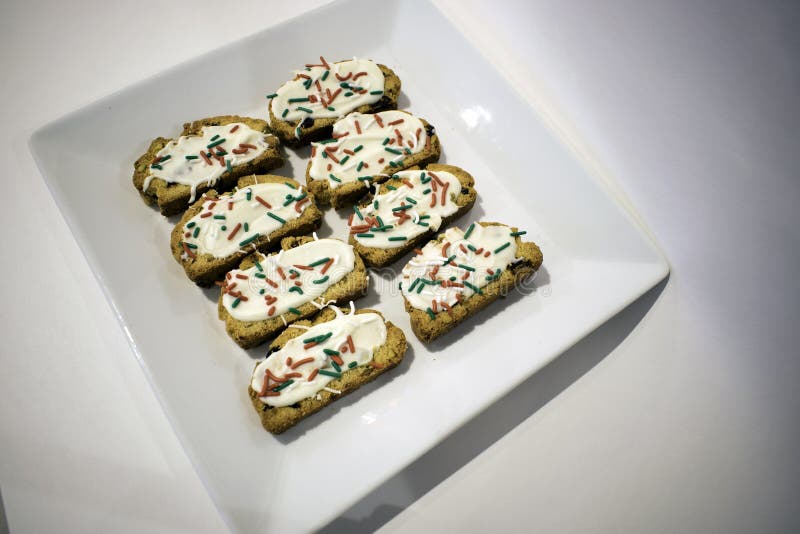 Several Decorated Cookies on a Square White Plate. Stock Photo - Image ...
