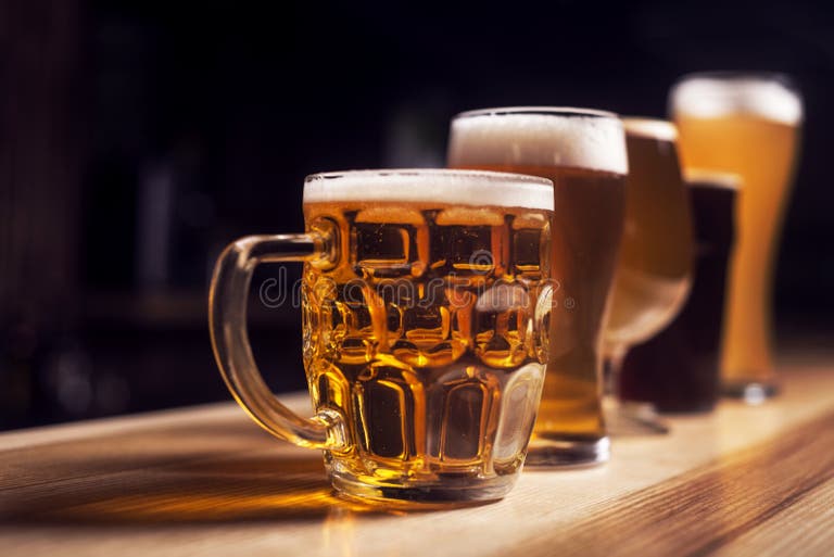 Several Different Beers are Standing in a Row Stock Photo - Image of ...